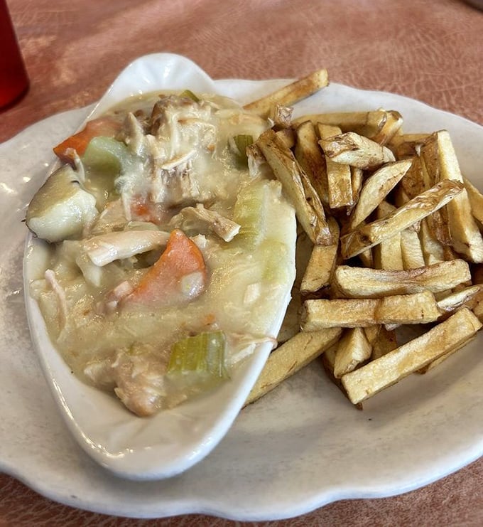 Not just chicken pot pie—it's Pennsylvania Dutch-style comfort in a bowl, where vegetables and chicken swim in gravy alongside hand-rolled dumplings.