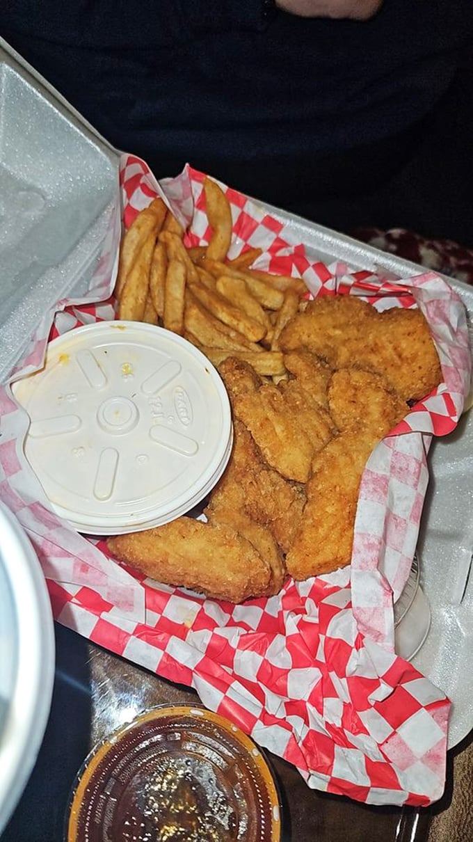 Golden-fried chicken tenders that crunch louder than your diet plans. That dipping sauce isn't just condiment – it's commitment.