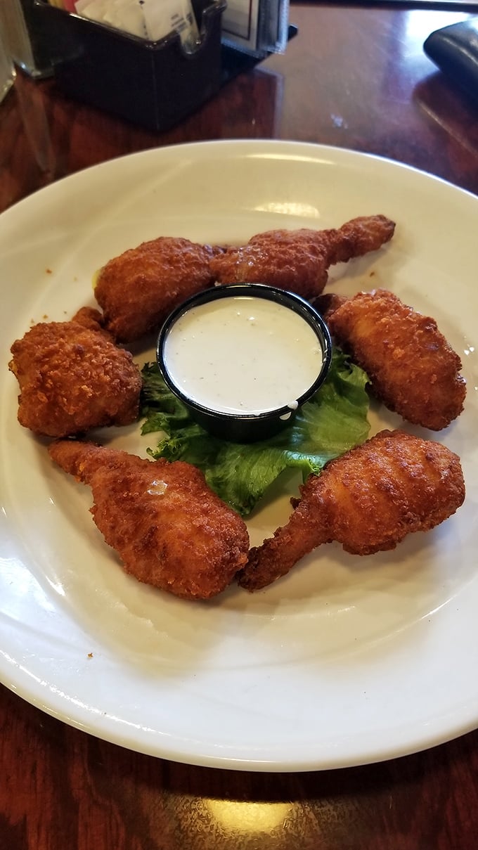 These chicken wings aren't just fried, they're transformed—crispy on the outside, juicy within, and served with a dipping sauce worth bottling.