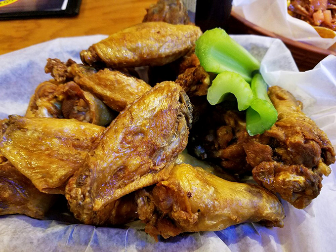 Wings that don't need a sporting event excuse – crispy, golden-brown perfection with just the right amount of heat to make you reach for your sweet tea.