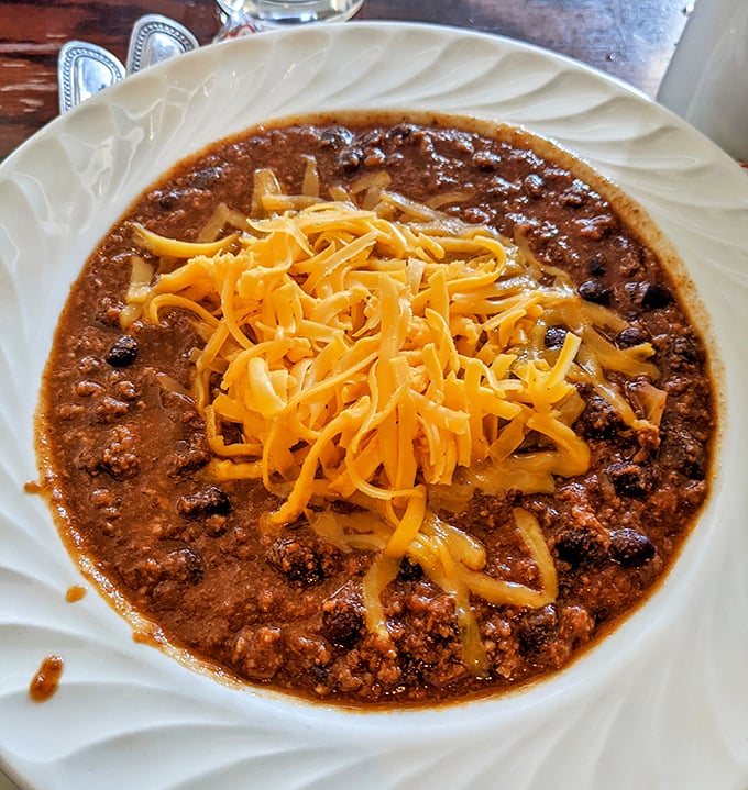 A bowl of chili that doesn't just warm your stomach but your soul. The melted cheese on top is like a cozy blanket for your taste buds.