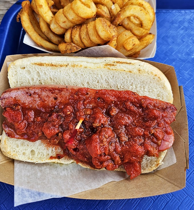 Not just any chili dog—a masterpiece of messy perfection that demands multiple napkins and zero dignity concerns.
