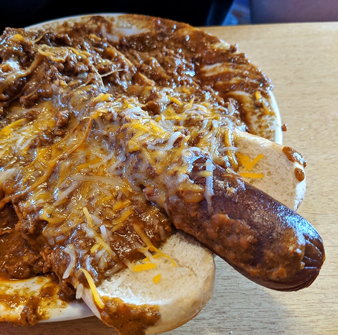 When a hot dog disappears beneath this much chili and cheese, it's not hiding—it's becoming part of something greater than itself.