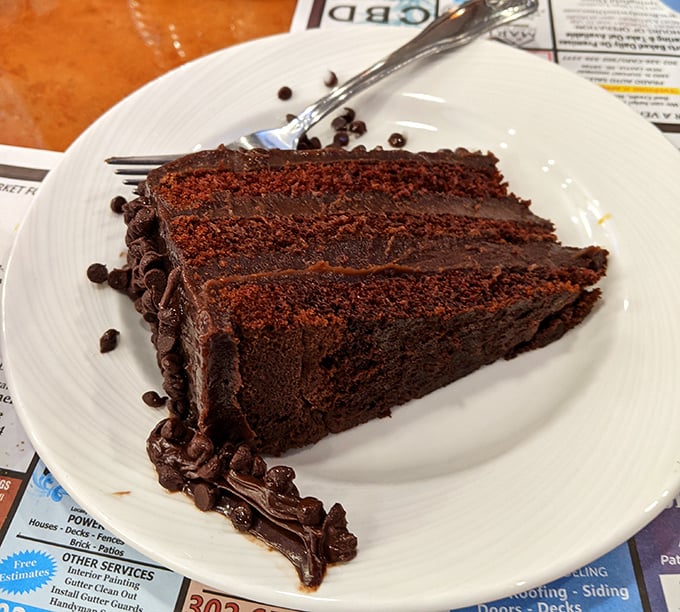 This chocolate cake isn't just dessert—it's three layers of therapy that doesn't ask about your feelings, just makes them better with each forkful.