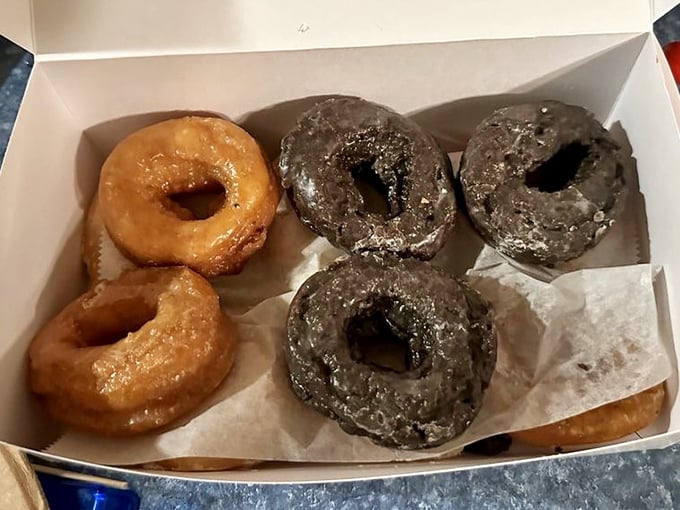 The classic combination—golden glazed and chocolate cake donuts. Like Batman and Robin of the pastry world, they're the dynamic duo we deserve.