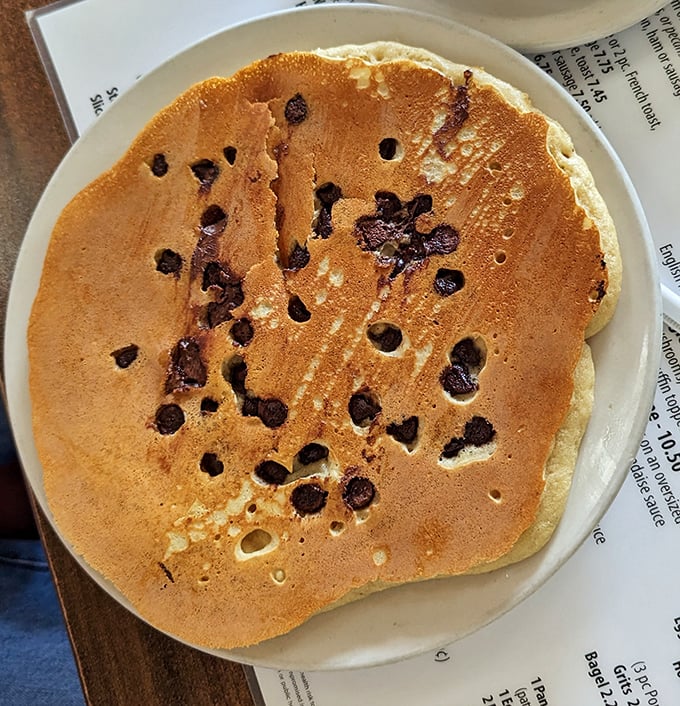 A chocolate chip pancake the size of a frisbee. Not that you should throw it—that would be a culinary crime.