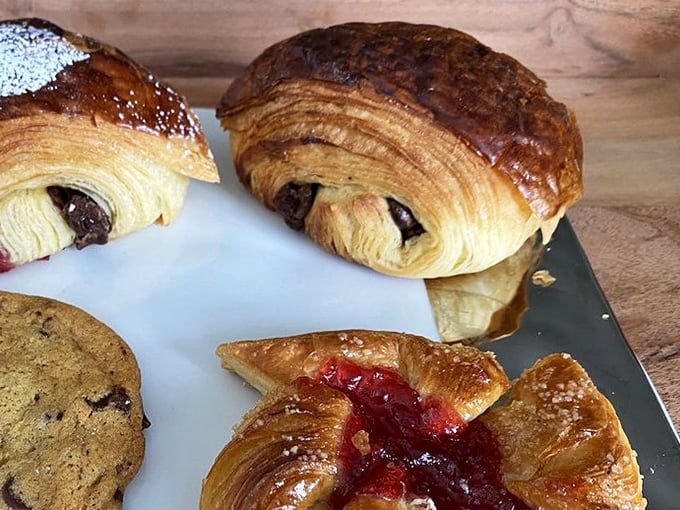 Layers upon layers of buttery perfection. These croissants don't just flake—they shatter with delicate precision, revealing pockets of chocolate treasure within.