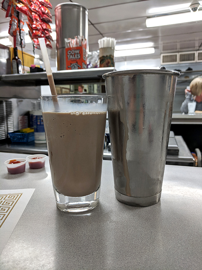The chocolate shake arrives in two parts—glass and mixing tin—because K's knows portion control is something that happens in other restaurants.