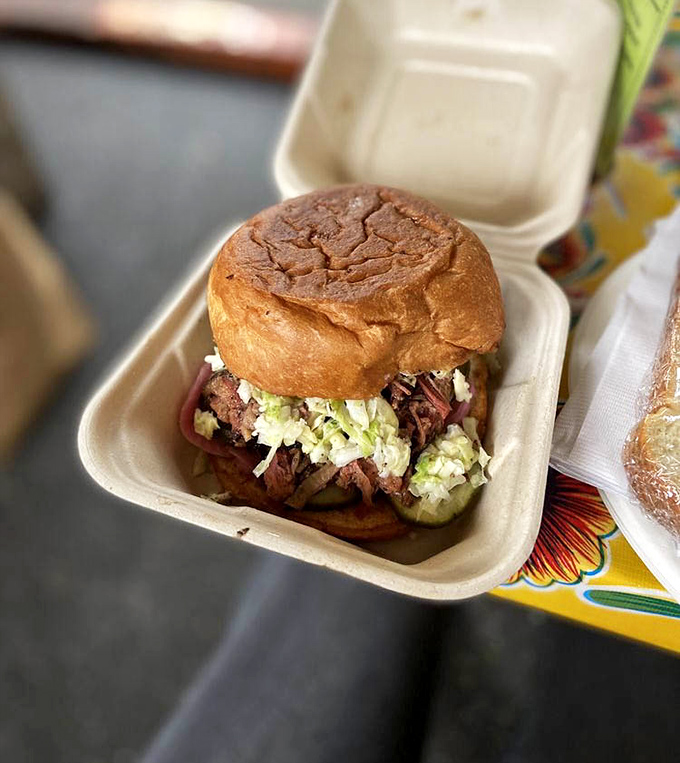 The chopped brisket sandwich—a perfect meat-to-bun ratio with just enough slaw for crunch. Simplicity that belies the complexity of flavor within.