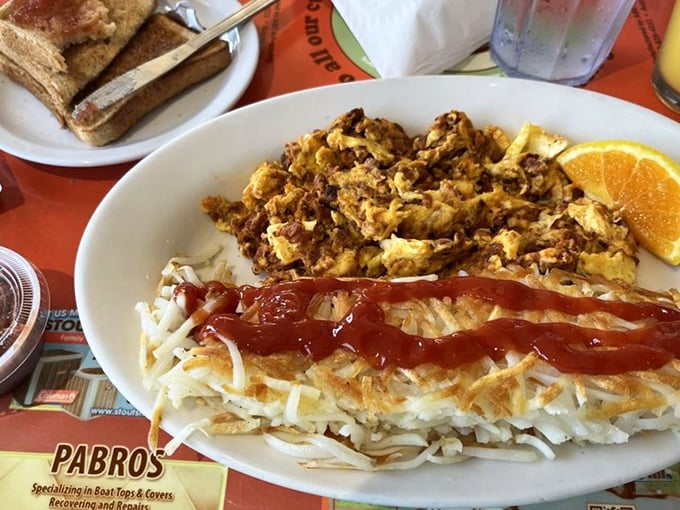 This isn't just breakfast—it's a masterpiece of textures where crispy hash browns meet scrambled eggs in perfect harmony.