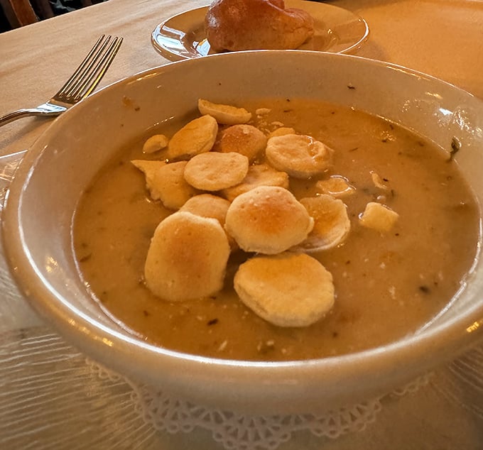 This isn't just clam chowder – it's a warm hug in a bowl, complete with those adorable oyster crackers floating like little life preservers.