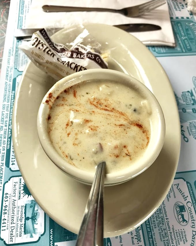 A bowl of New England clam chowder so authentic it practically tells sea stories while warming you from the inside out.