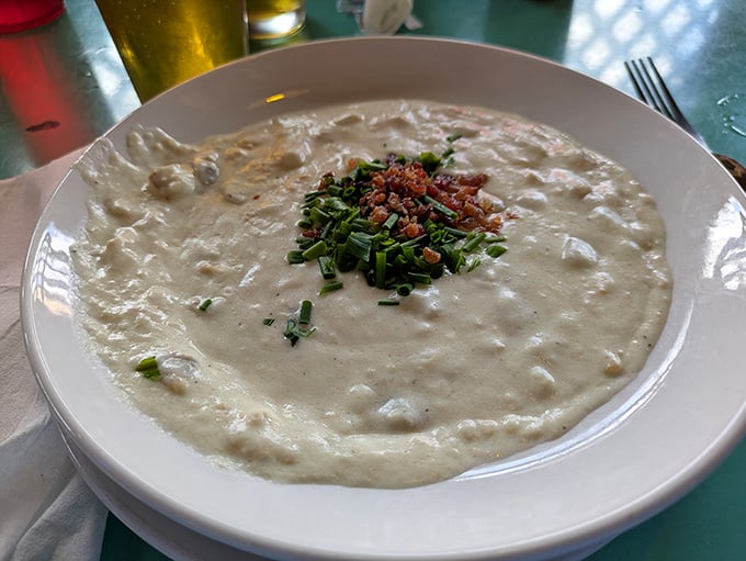 This clam chowder, topped with fresh chives and bacon, isn't just soup – it's a creamy bowl of maritime comfort that demands crusty bread.