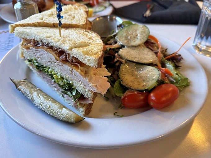 The club sandwich: architecture you can eat. Three stories of deliciousness held together with toothpick support beams and a foundation of fresh ingredients.