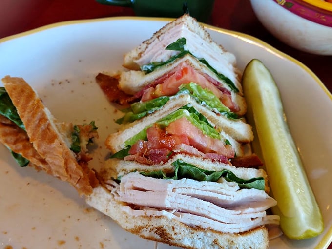 Club sandwich architecture at its finest – layers of goodness that would make Frank Lloyd Wright proud of this edible masterpiece.