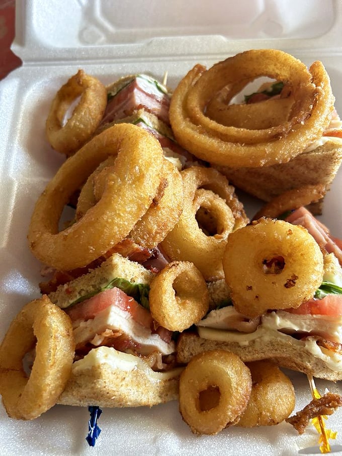The sandwich equivalent of a warm hug - crispy onion rings piled high on what might be the most perfect club sandwich in Ohio.