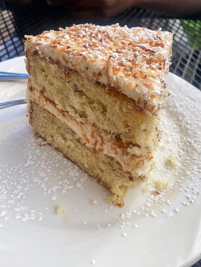 Layer upon layer of coconut cake perfection. The kind of dessert that makes you consider skipping the entrée entirely.