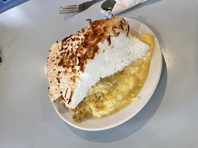 Coconut cream pie with a toasted top that would make any dessert lover weak at the knees. This isn't just dessert—it's therapy.