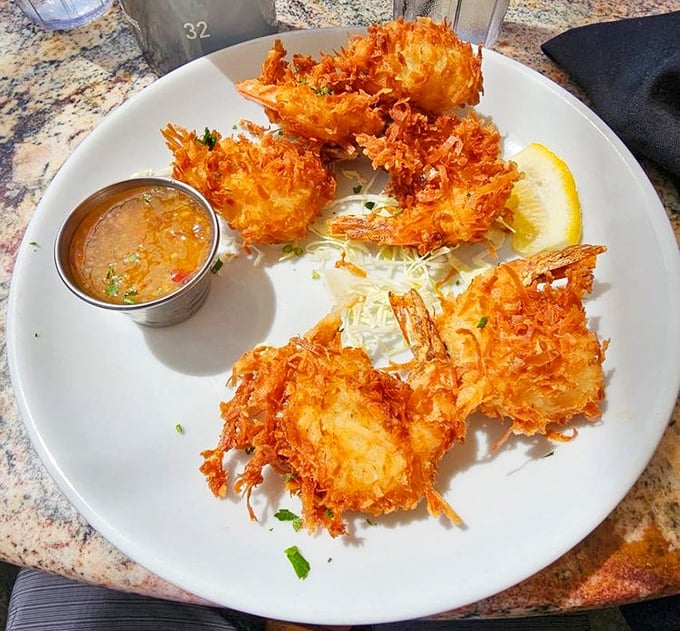 Coconut shrimp that look like they're wearing little tropical party outfits—crispy, sweet, and ready to transport you to island time with one bite.