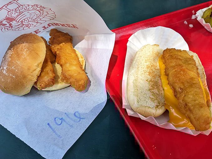 Fish sandwiches that would make coastal snobs reconsider their prejudices—golden-battered cod nestled in soft buns, proof that great seafood can happen anywhere.