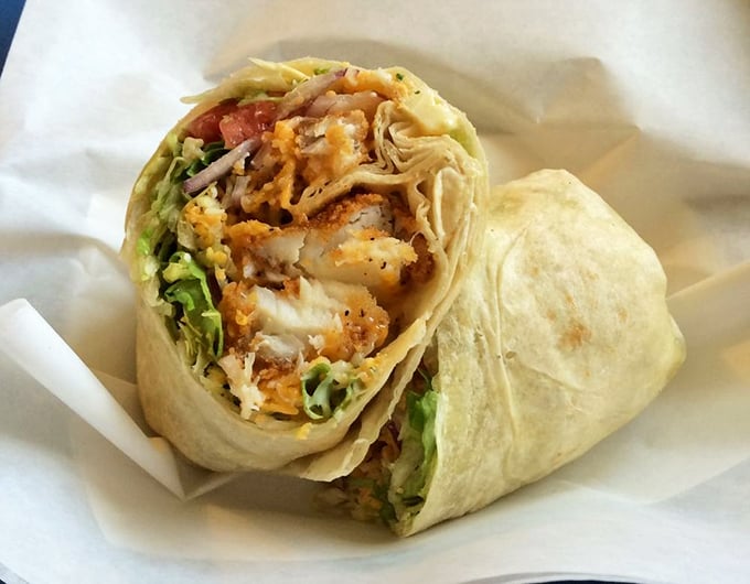 The Cod Wrap brings the ocean's bounty into a tidy, handheld package – crispy fish, fresh veggies, and house sauce creating harmony in every bite.