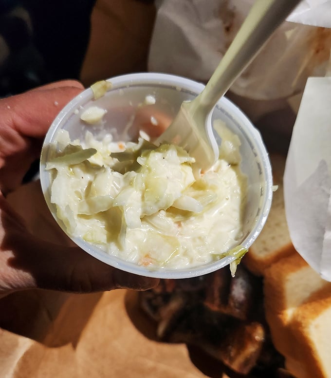Lem's coleslaw isn't an afterthought—it's the cool, creamy counterpoint that your taste buds didn't know they needed until now.