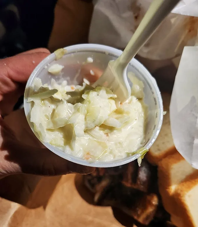 Lem's coleslaw isn't an afterthought—it's the cool, creamy counterpoint that your taste buds didn't know they needed until now.
