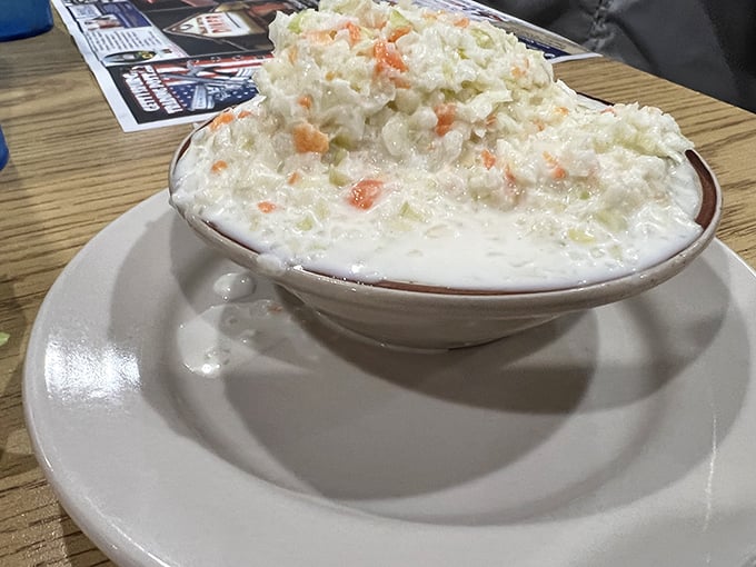 Coleslaw that doesn't know it's a side dish—it thinks it's the main event. Creamy, crunchy, and studded with carrots like little orange jewels.