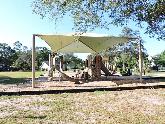 This playground proves retirement towns aren't just for grandparents – the little ones get their slice of shaded fun too!