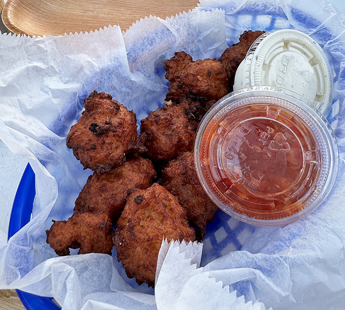Conch fritters – little hush-puppy-like spheres of the sea that deliver a satisfying crunch before revealing their tender, flavorful interior.