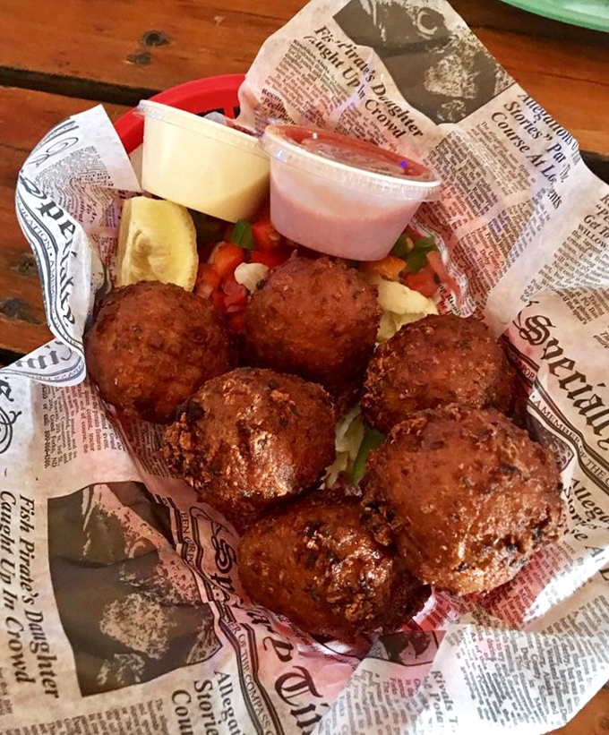 Conch fritters golden-fried to perfection—these crunchy spheres of Keys tradition come with a dipping sauce worth bottling and smuggling home.