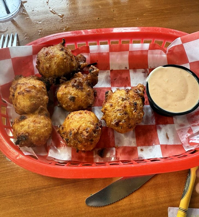 Conch fritters golden-fried to perfection—little hush puppies of the sea that deliver a taste of the Bahamas with every bite.
