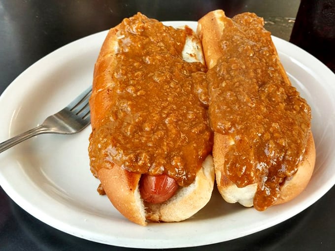 Coney dogs smothered in that signature chili—proof that sometimes the messiest foods are the most satisfying.