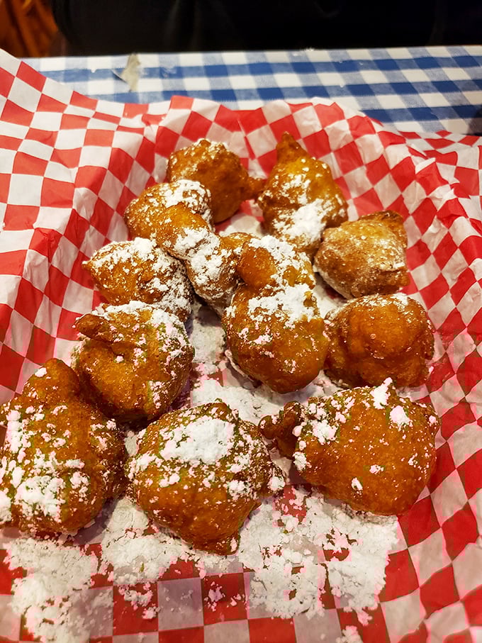 These corn fritters dusted with powdered sugar aren't just dessert – they're little clouds of joy that somehow taste like summer state fairs.