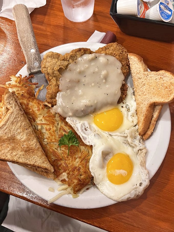 Country fried steak with those legendary hash browns—proof that sometimes the best therapy comes on a plate rather than a couch.