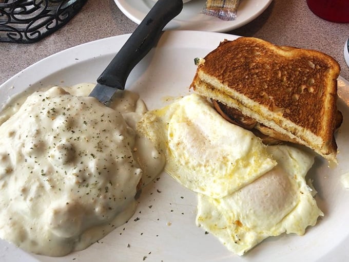 Country fried steak and eggs—the breakfast of champions who plan on napping later. That pepper-flecked gravy is practically begging for a biscuit dunk.