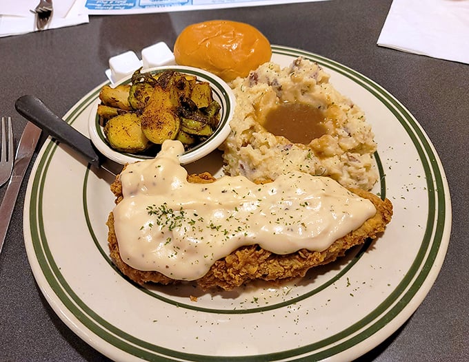 Country-fried steak smothered in gravy—when your cardiologist isn't looking but your soul needs immediate comfort.