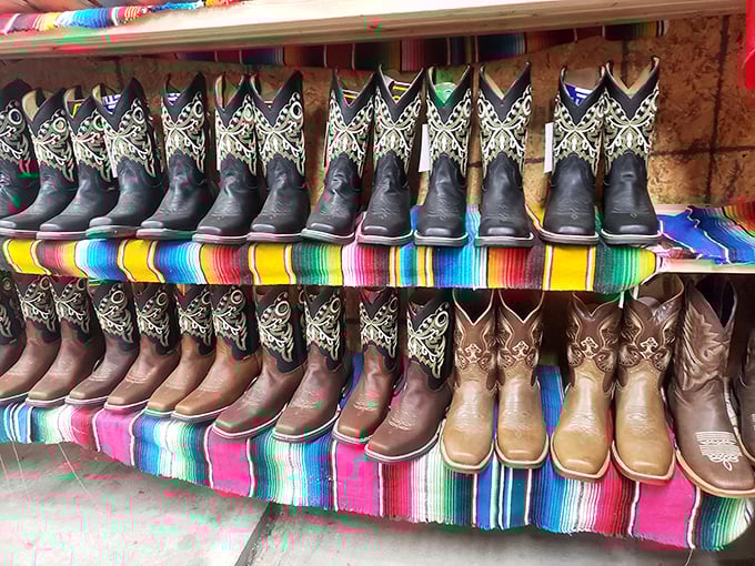 Boot heaven for aspiring cowboys and fashionistas alike – lined up like a chorus line of leather performers on a technicolor Mexican blanket stage.