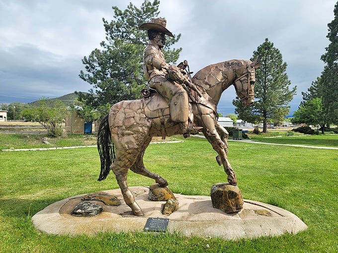 This bronze cowboy doesn't just commemorate Western heritage—he's silently judging modern horsemen who need GPS to find the trail.