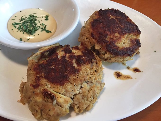 These crab cakes are what other crab cakes dream of becoming – mostly crab, minimal filler, and perfectly seared. Seafood integrity on a plate.