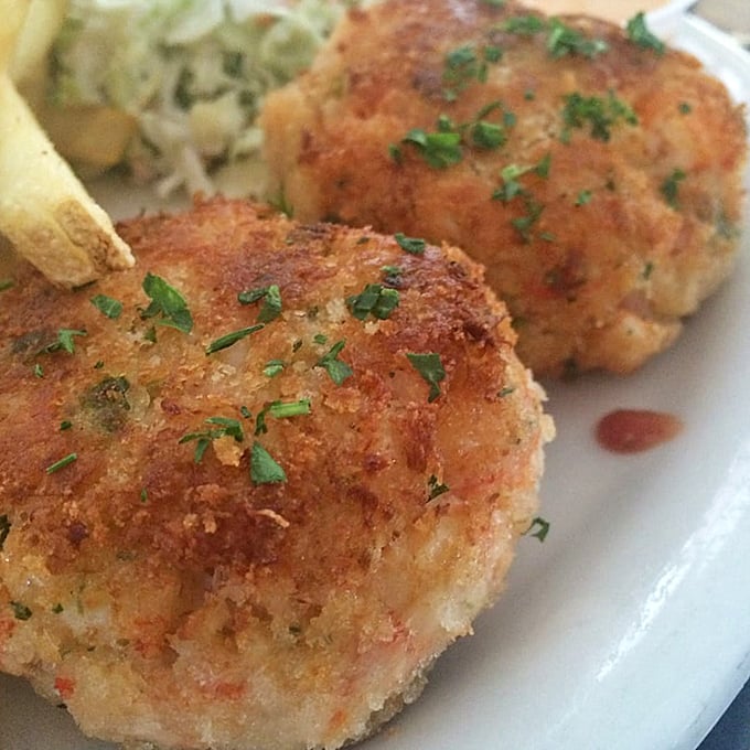 Golden on the outside, heavenly on the inside. These crab cakes aren't just appetizers—they're the opening act to a symphony of seafood.