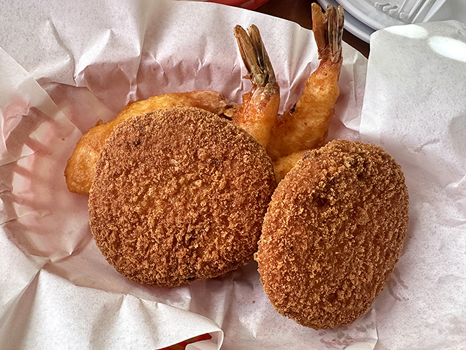 These golden-brown crab cakes and plump prawns aren't just seafood – they're edible proof that Fresno might secretly have an ocean we don't know about.