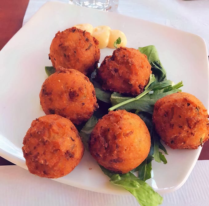 Hushpuppies that speak volumes—crispy spheres of cornmeal joy that might just be worth the drive to Erie alone.