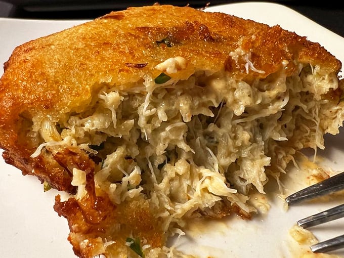 This crab cake has more lump crab than filler—a refreshing commitment to seafood integrity that deserves a standing ovation.