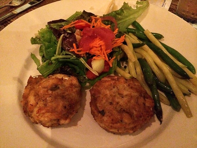 These golden-brown crab cakes aren't just appetizers—they're little discs of Delaware happiness served with seasonal vegetables.