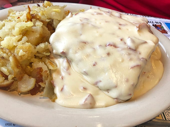 The holy grail itself—creamed chipped beef cascading over potatoes like a savory waterfall, transforming humble ingredients into comfort food royalty.