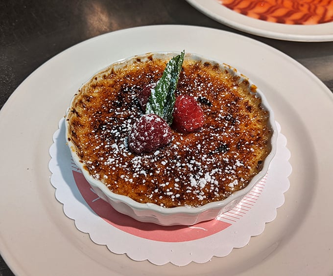 The crème brûlée's crackling sugar top gives that satisfying "tap-tap-crack" that's basically percussion for your dessert course.