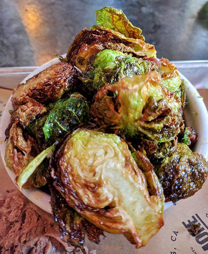 Brussels sprouts that have undergone a transformation more dramatic than any Hollywood makeover – crispy, caramelized, and completely irresistible.