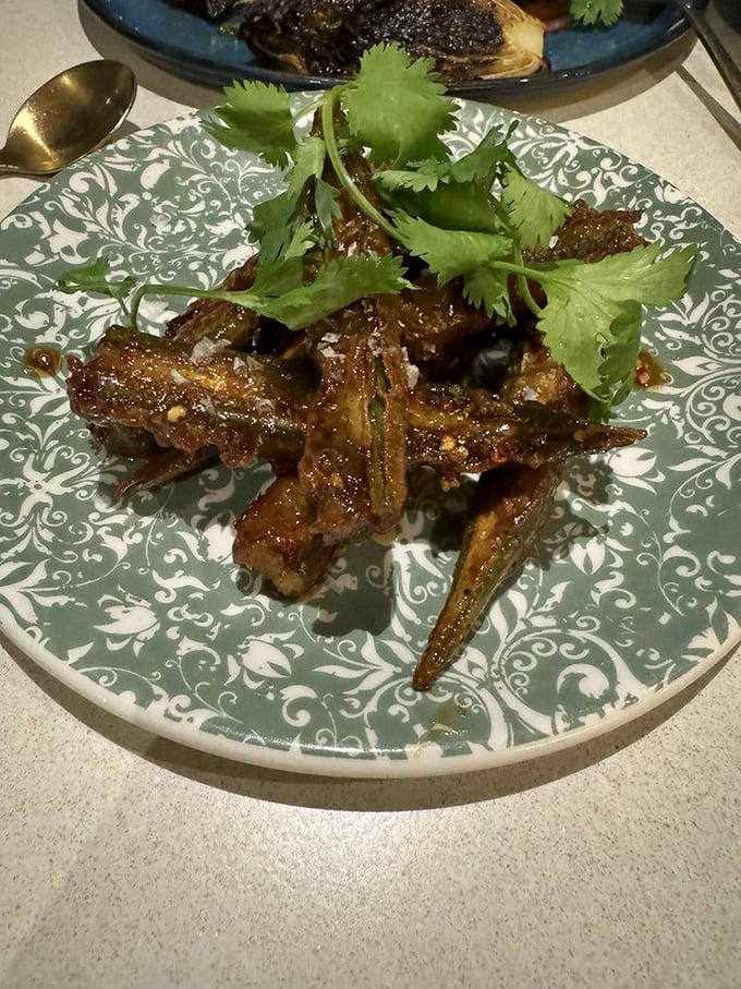 These aren't your grandmother's okra—unless your grandmother was a culinary genius. Crispy, glazed, and topped with fresh cilantro for the perfect bite.