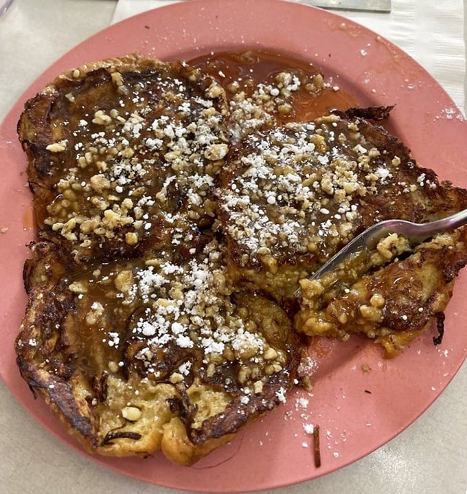 Croissant French toast that makes regular bread seem like a tragic waste of opportunity. The caramel sauce is basically breakfast jewelry.